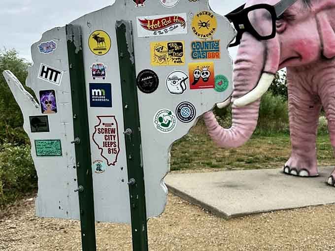 Road trip warriors leave their mark here, turning this elephant into a rolling billboard of adventure.