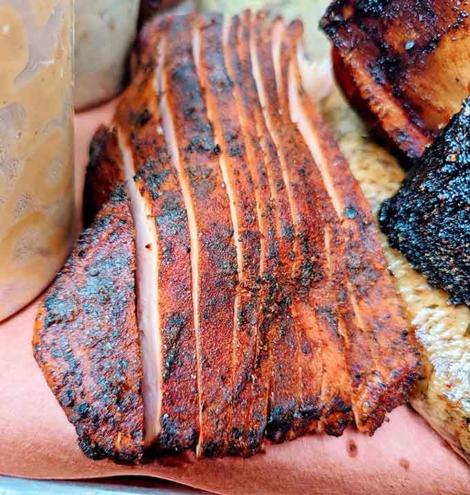 Sliced turkey with a smoke ring this visible doesn't need to brag, the evidence speaks plenty loud enough.