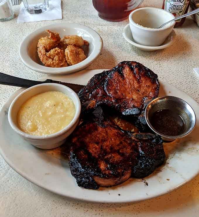 Charbroiled pork chops with cheese grits and fried shrimp create the kind of Southern feast dreams are made of.