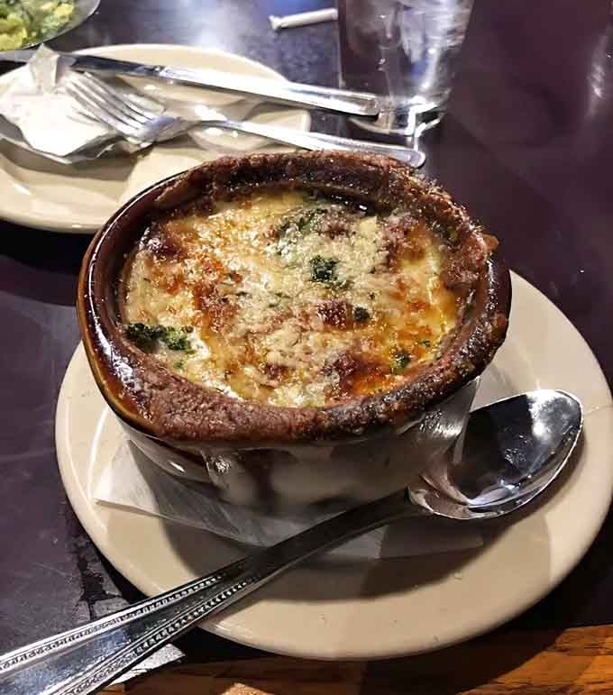 French onion soup bubbles under a cheese crust that stretches like a delicious, gooey bridge.