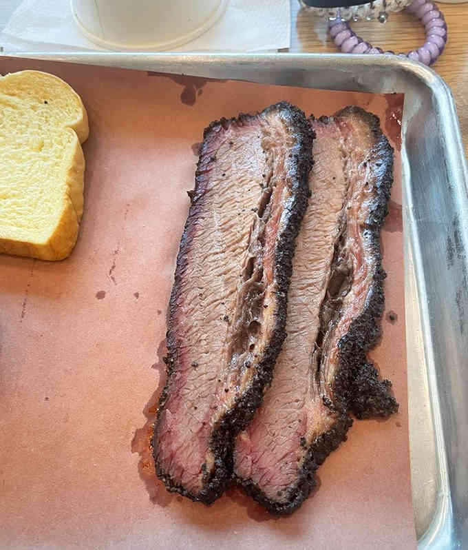 Sliced brisket so tender and juicy, it practically melts before reaching your mouth. Pure barbecue perfection right here.