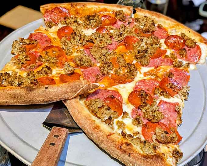 Three Little Pigs pizza loaded with enough meat to satisfy your inner carnivore without overwhelming the crust.