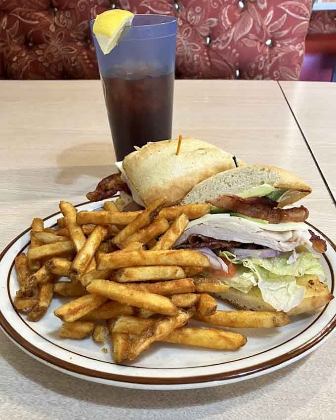 A proper club sandwich stacked high with crispy fries, because lunch deserves the same love as breakfast.