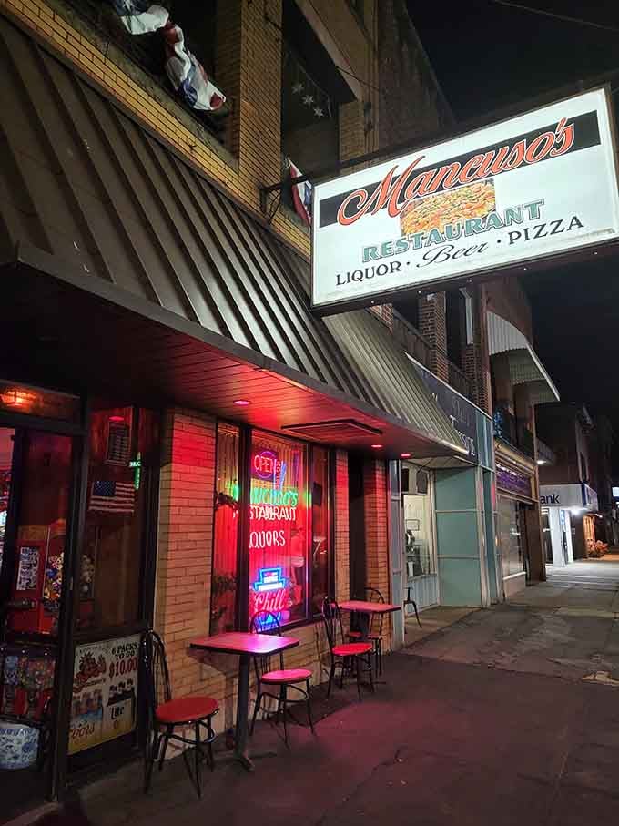 Neon signs glow invitingly on Main Street, where local restaurants serve up hometown hospitality after dark every night.