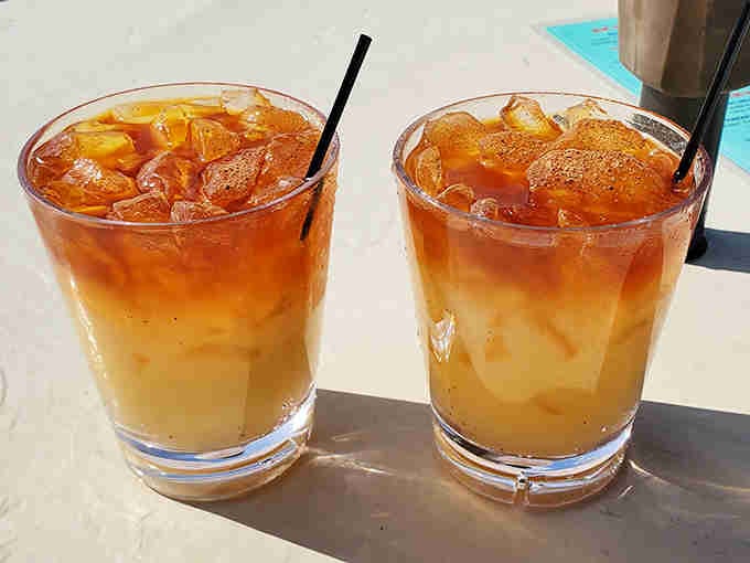 Tropical cocktails with that perfect sunset gradient remind you that happiness sometimes comes in a glass with ice.