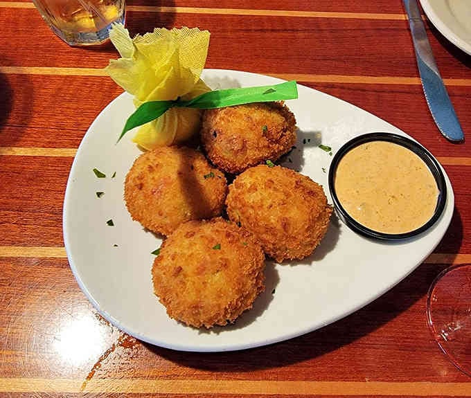 Golden crab balls with remoulade sauce, because sometimes the best things in life come in perfectly fried spherical packages.