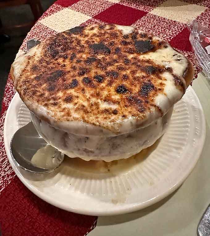 French onion soup topped with cheese that stretches like a delicious, melty bridge to happiness in a bowl.