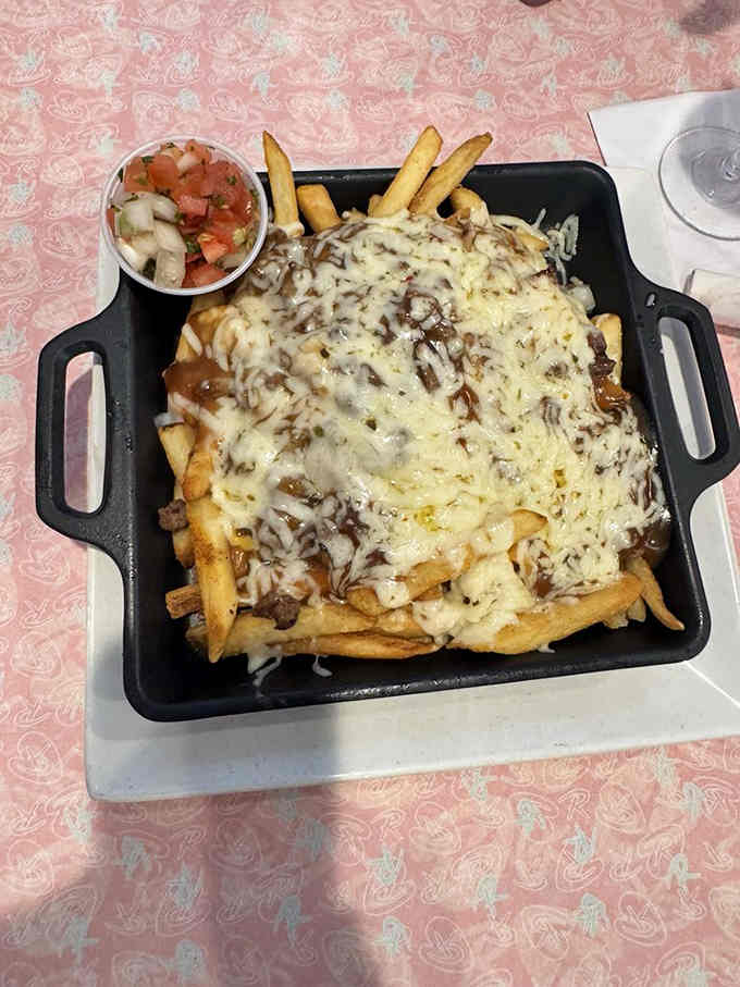 Chili cheese fries served in a skillet because regular plates are for people without ambition or appetite.