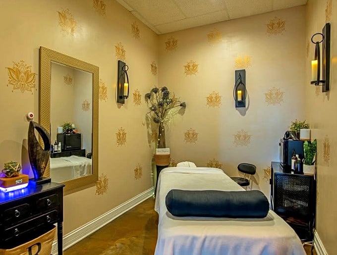 Golden accents and elegant wallpaper transform this Royal Salt Cave & Spa massage room into pure sophisticated tranquility personified beautifully.