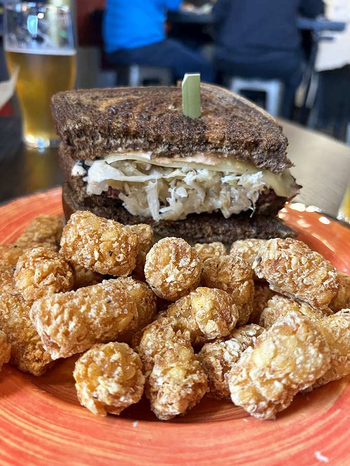 A proper Reuben with sauerkraut spilling out the sides, because restraint is overrated when corned beef's involved.