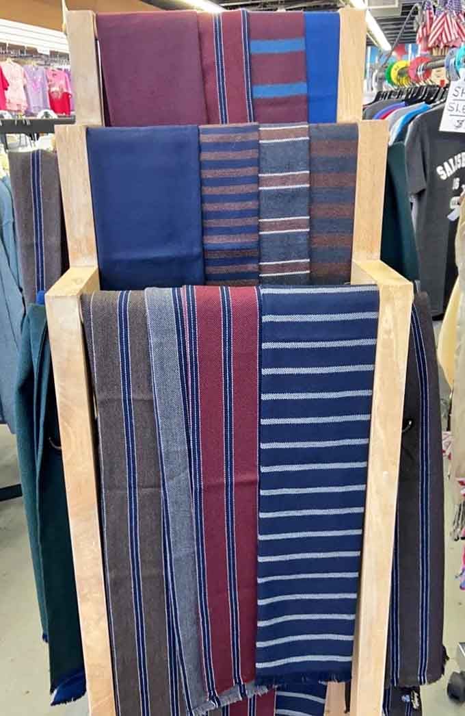 Striped scarves in rich burgundies and navies bring unexpected sophistication to a discount store's casual beach vibe.