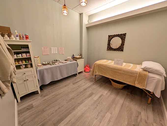 The massage room offers a serene space where tension goes to retire permanently from your shoulders.