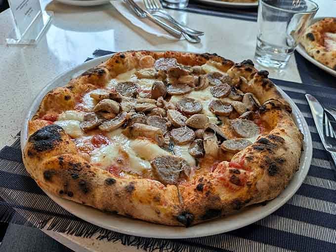 Mushrooms and melted cheese on that blistered crust deliver comfort food elevated to fine dining status.