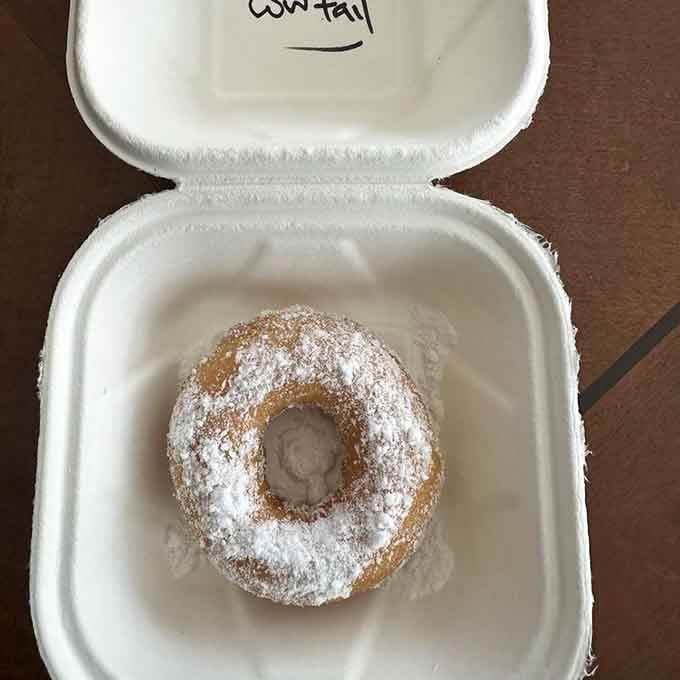 Powdered sugar so generous it looks like a tiny snowstorm decided to take up permanent residence.