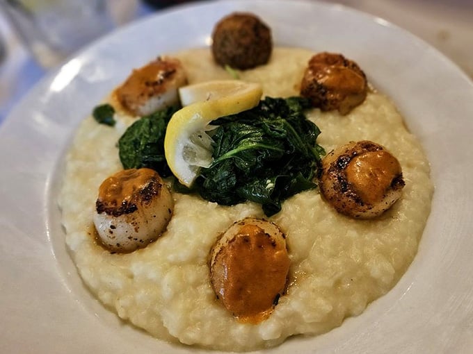 Perfectly seared scallops nestled on creamy risotto, because sometimes elegance is the best way to show off quality ingredients.