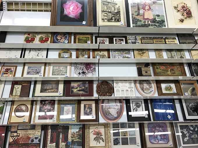 Framed art waiting for walls, from tasteful landscapes to pieces that make you wonder about the previous owner's decorating philosophy.