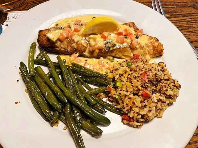 Walleye so perfectly charred it could teach a masterclass, flanked by green beans and quinoa doing supporting roles.