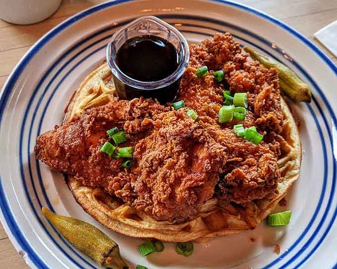 Crispy fried chicken on waffles with pickles and syrup, because why choose between breakfast and lunch when you can have both?