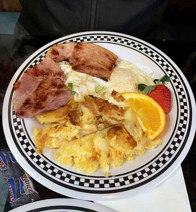 Bacon, eggs, and hash browns arranged like edible art, garnished with hope and possibly a food coma warning label.