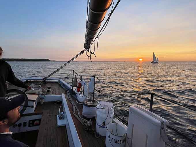 Sailing into a Door County sunset, where the water glows gold and landlubber problems fade into the distance.
