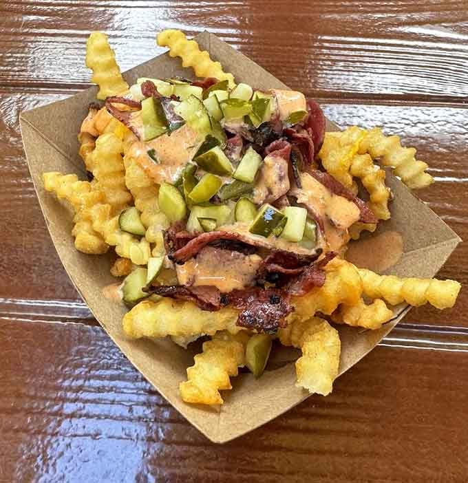 Pastrami fries topped with all the fixings transform a simple side into a meal worth writing home about.