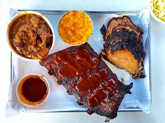 This platter showcases the holy trinity of barbecue with sides that actually deserve their spot on the tray.