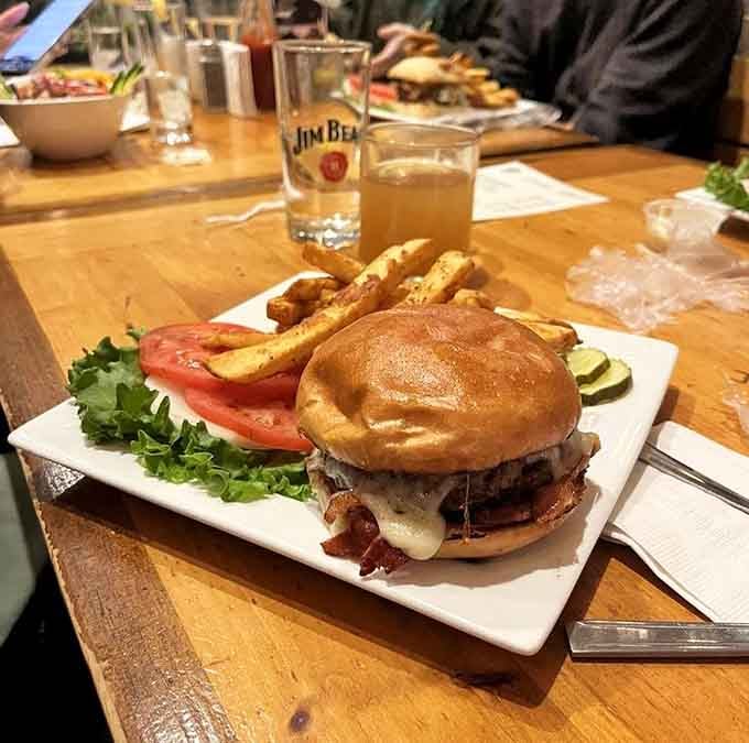 That burger's stacked higher than your hiking boots after a day on the trails.