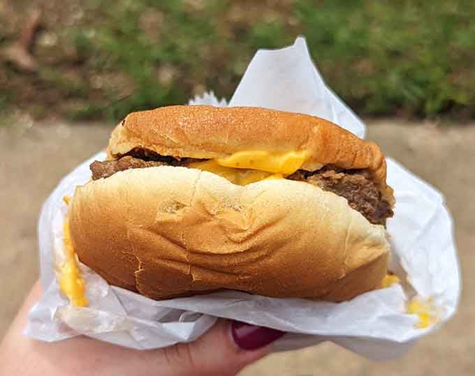 Two cheeseburgers wrapped and ready, proving you can feed multiple people without requiring a small loan.