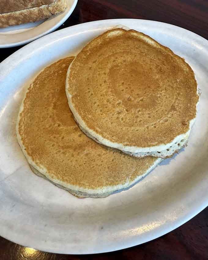 Golden, fluffy, and ready for their syrup bath, these pancakes understand the assignment perfectly and completely.