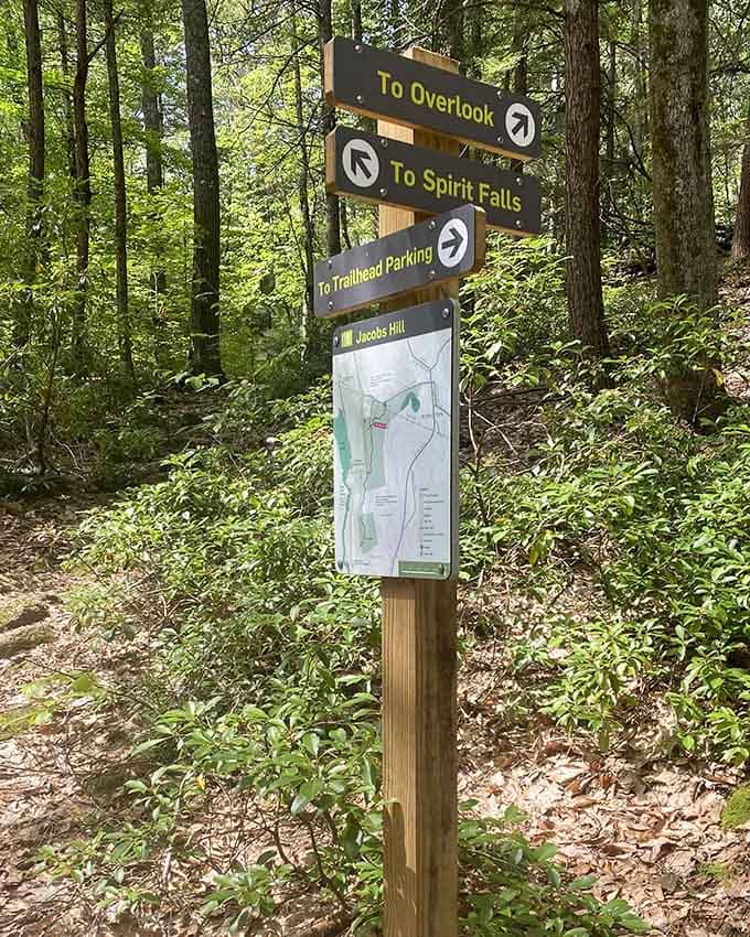 Trail signs pointing to Spirit Falls: your GPS to natural wonder and Instagram-worthy moments ahead.