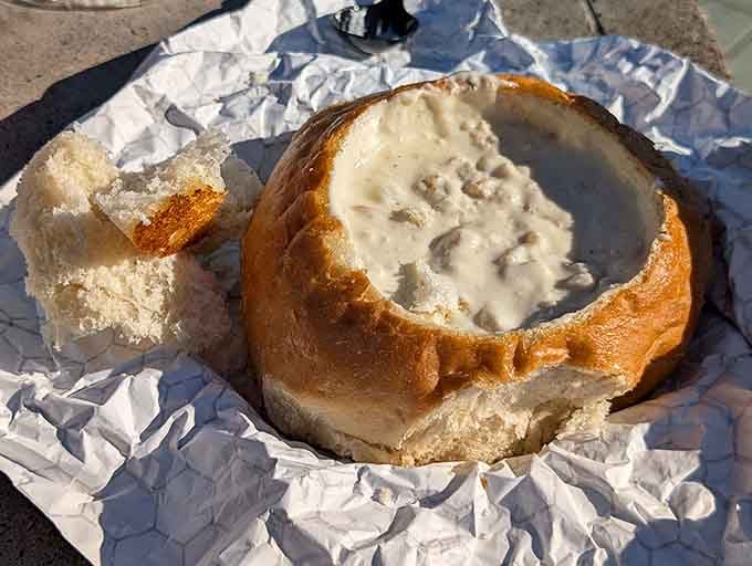 That bread bowl cradles thick, creamy chowder like edible architecture designed specifically for maximum deliciousness and minimal spillage.
