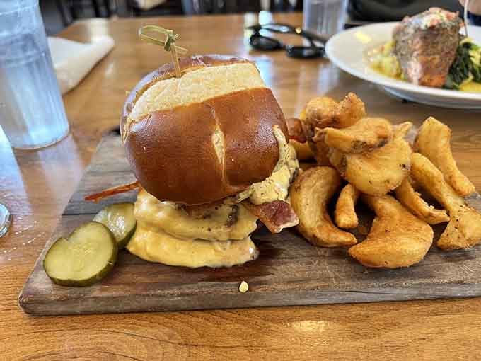 The pub burger arrives stacked high on a pretzel bun, because regular buns are for regular places.