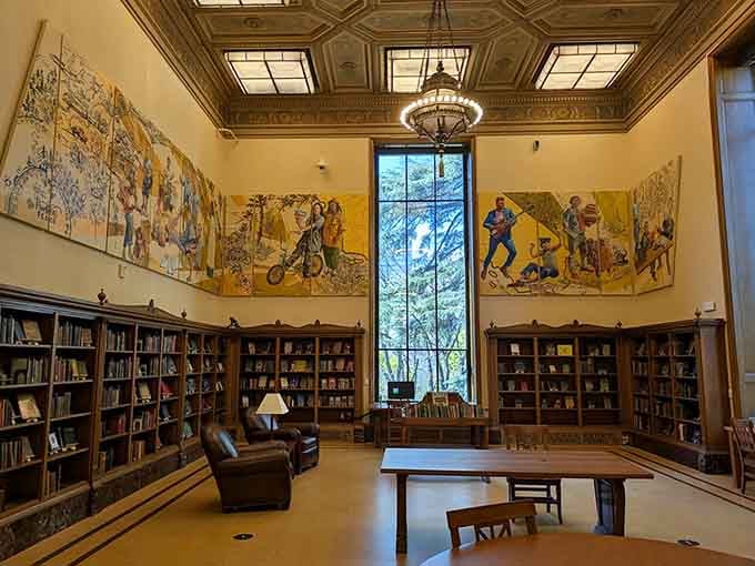 High ceilings and wall murals transform this reading room into something straight from a scholarly fantasy novel.