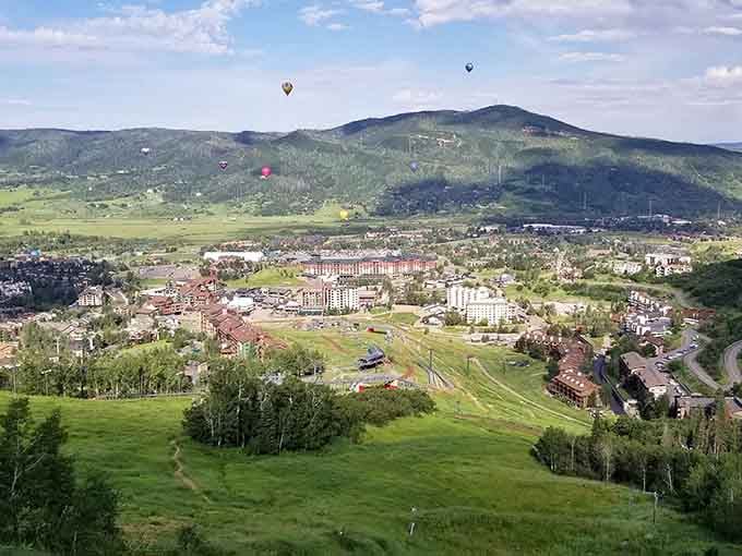 Hot air balloons drift over Steamboat like colorful dreams floating across your retirement bucket list.