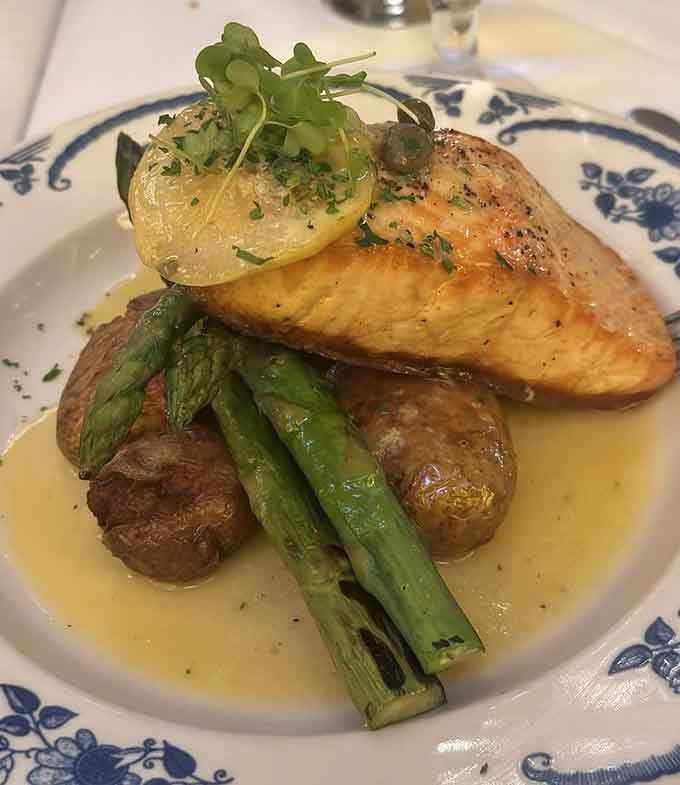 Golden-crusted salmon perched on roasted potatoes and asparagus shows that Italian restaurants can master more than pasta.