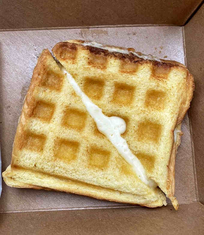 The cheese pull captured mid-stretch is basically food photography gold, and your taste buds know it.