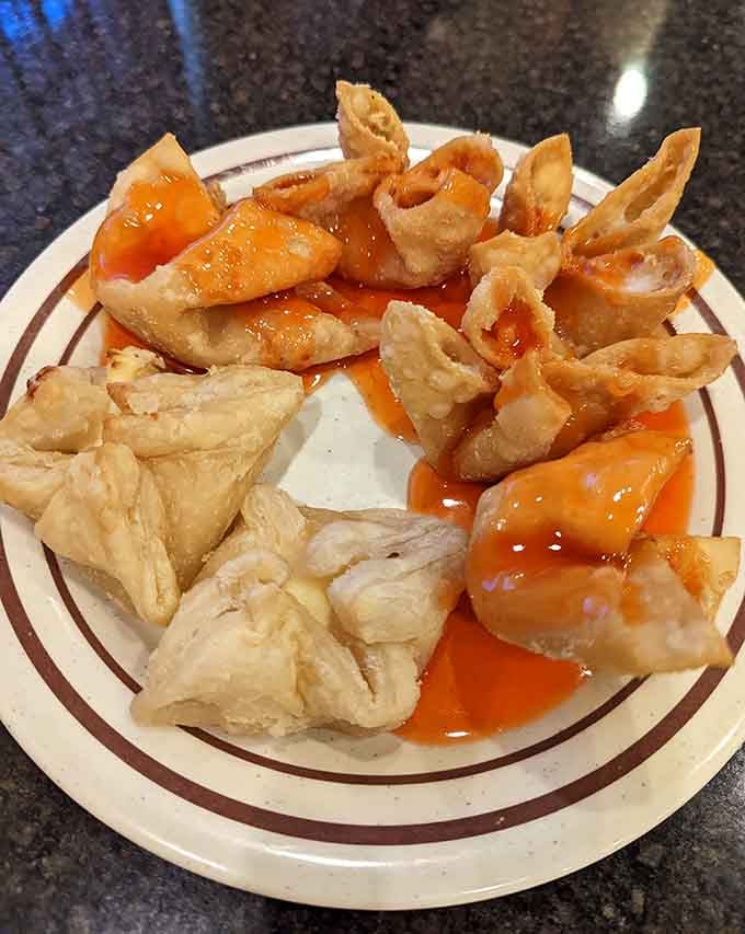 Golden crab rangoon and crispy wontons proving that sometimes the best things in life are indeed fried to perfection.