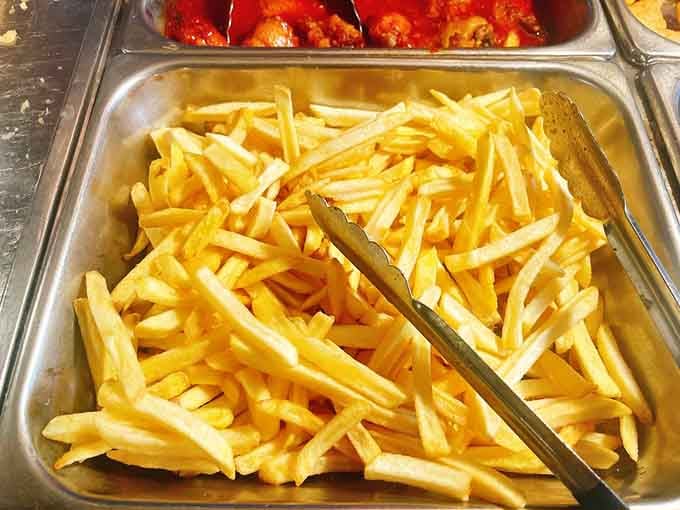 Golden french fries prove that even seafood buffets understand the universal language of perfectly crispy comfort food.