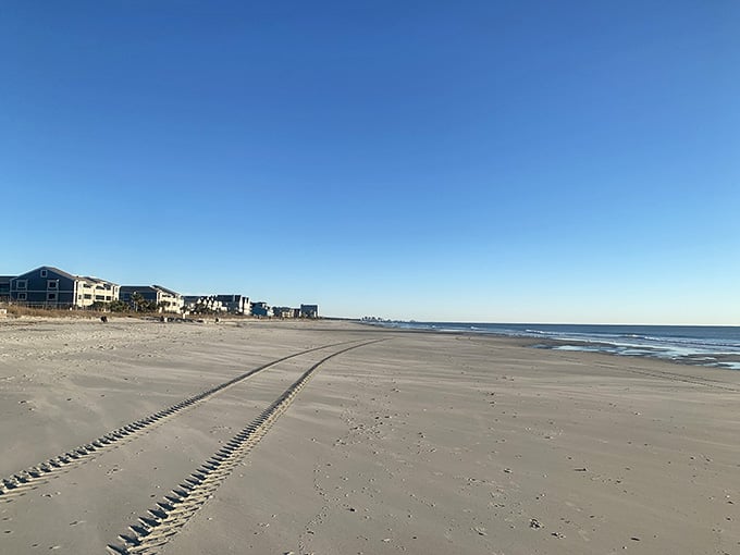 Wide open sand that lets you spread out without accidentally becoming part of your neighbor's family photo.