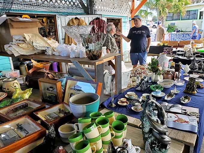 Vintage pottery and household treasures stacked like an archaeological dig where everything's actually for sale.