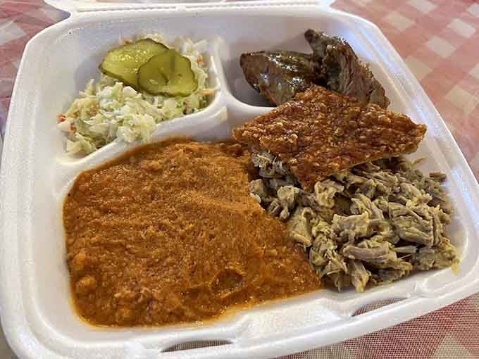 A barbecue plate that proves sometimes the best things in life come with hash, rice, and zero regrets whatsoever.