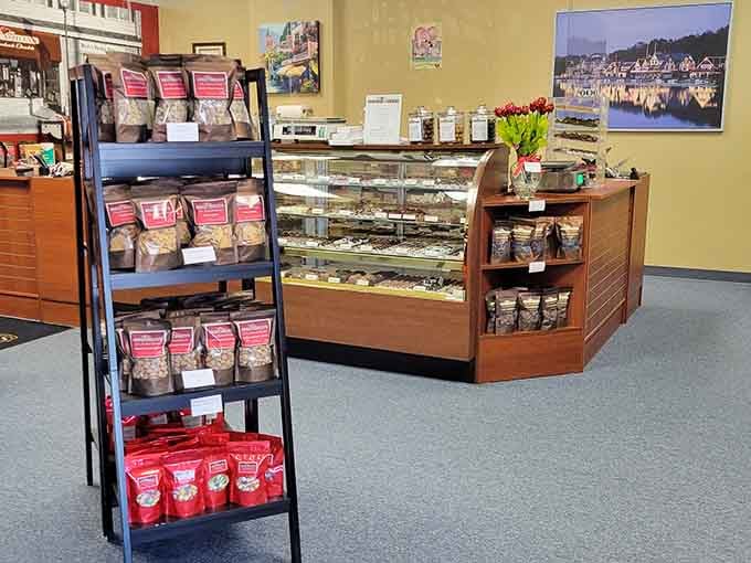 Fresh tulips brighten the counter while display cases gleam with handmade treasures waiting to be discovered and devoured.