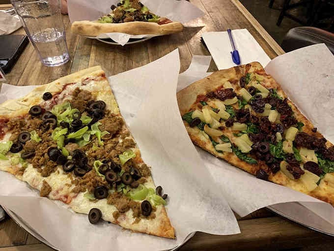 Two slices of the Sinatra pizza demonstrate that doing it your way sometimes means doing it really, really big.