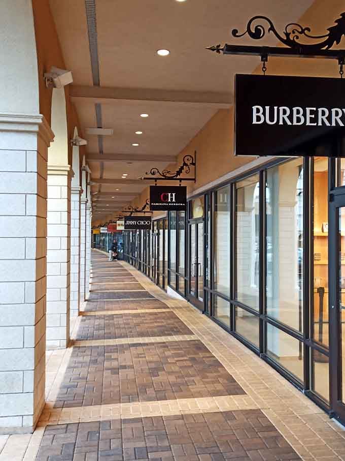 Luxury brands with wrought-iron elegance, because even outlet shopping deserves a touch of sophistication and architectural charm along the way.