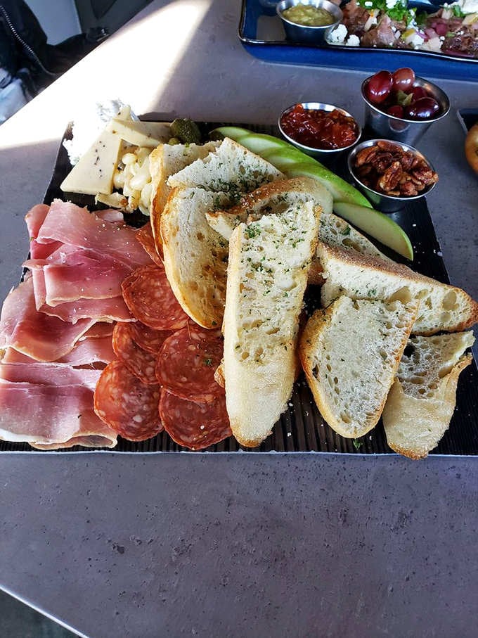 The charcuterie board that launched a thousand return visits, complete with meats, cheeses, and all the fixings your heart desires.