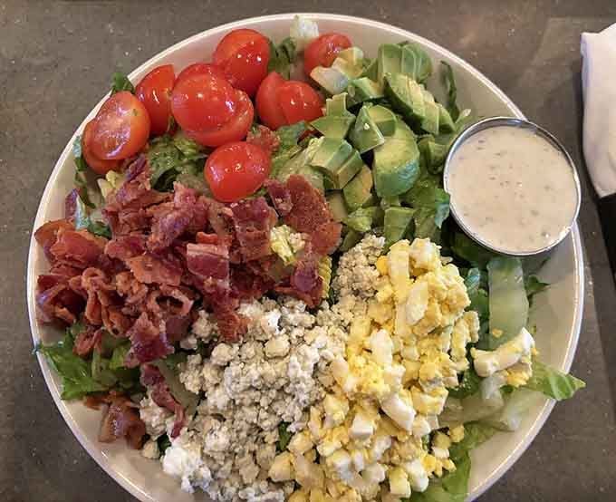 A Cobb salad so beautifully composed, you almost feel guilty disturbing it before diving in with your fork.