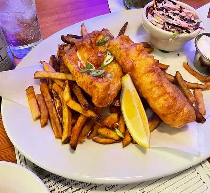 Golden-fried fish and chips that would make any British pub proud, served with coleslaw and perfectly crispy house-cut fries.
