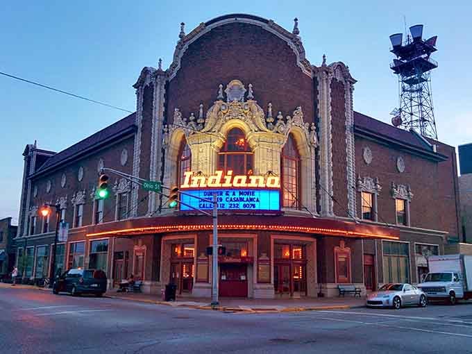 The Indiana Theatre's ornate facade glows at dusk, a stunning reminder of when movie palaces were architectural masterpieces.