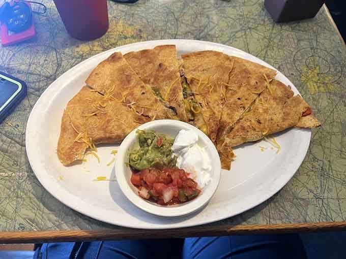 Golden quesadillas served with all the fixings, because even grounded flights deserve a fiesta on the side.