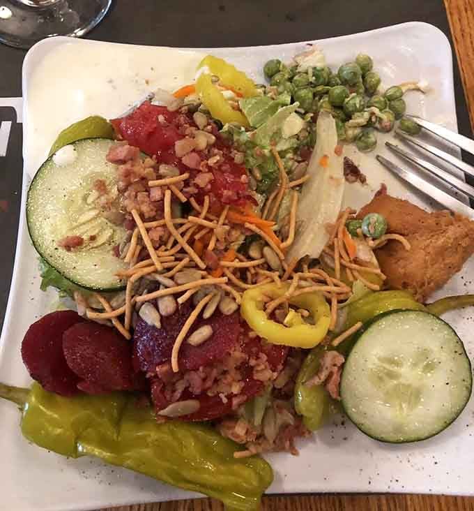 A salad bar done right, with fresh vegetables and toppings that actually look like they want to be there.
